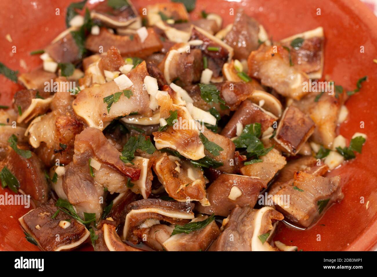 roasted pig ear with garlic and olive oil Stock Photo - Alamy