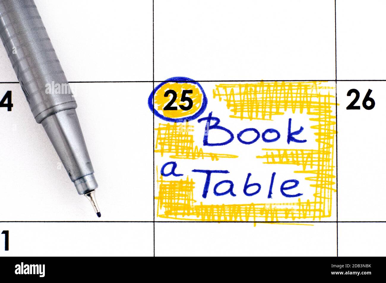 Reminder Book a Table in calendar with pen. Close-up Stock Photo - Alamy