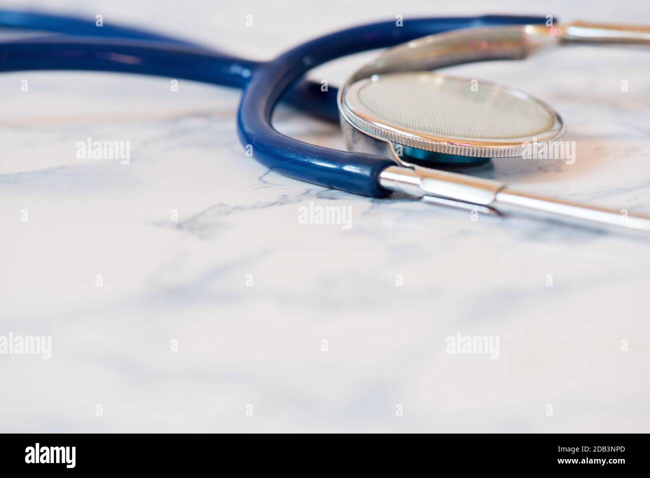 Macro shot of medical stethoscope or phonendoscope over light blue background Stock Photo - Alamy