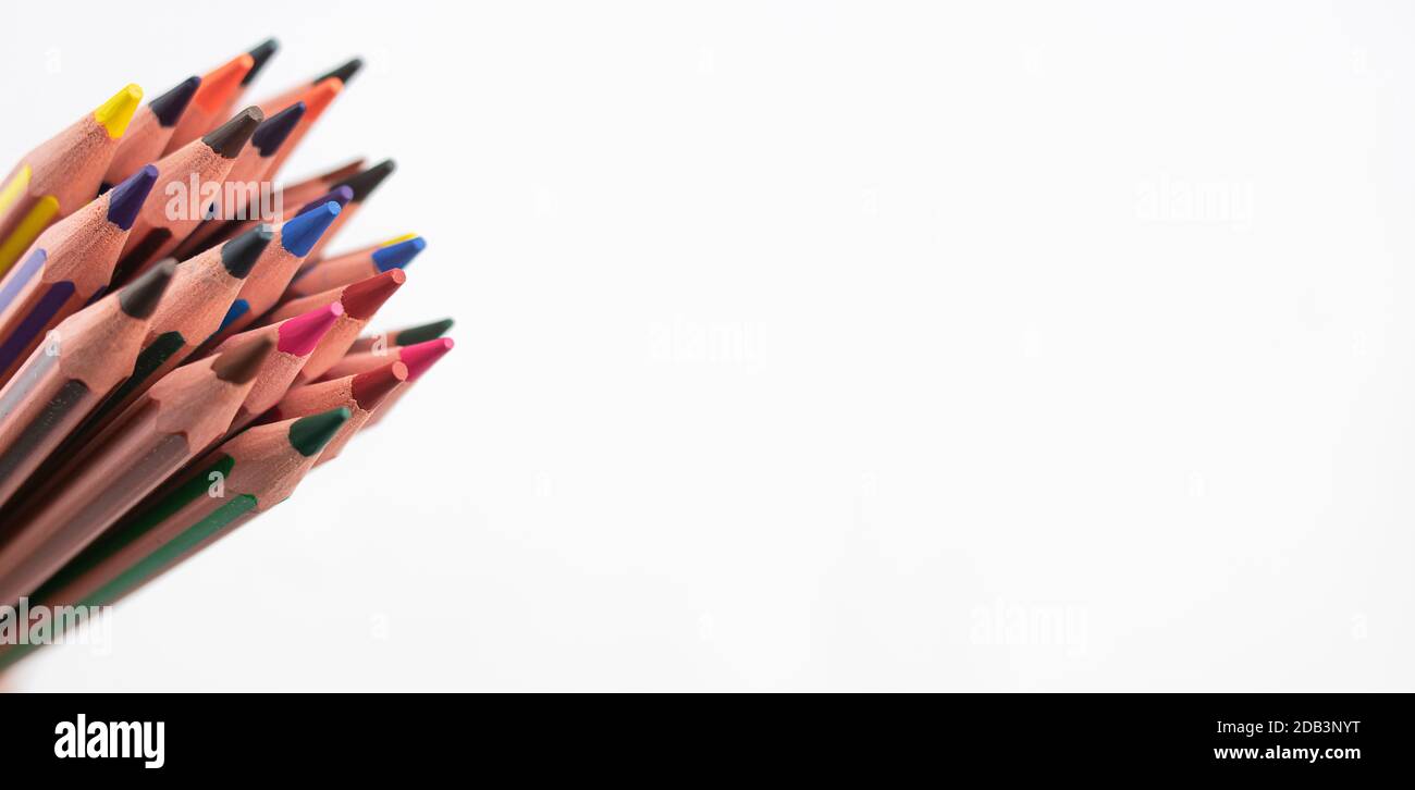 Colored pencils with sharp point that appear from the left side of the ...