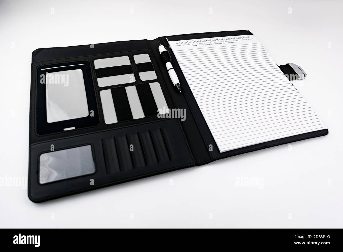 Notepad in a black leather folder with built-in pen Stock Photo - Alamy
