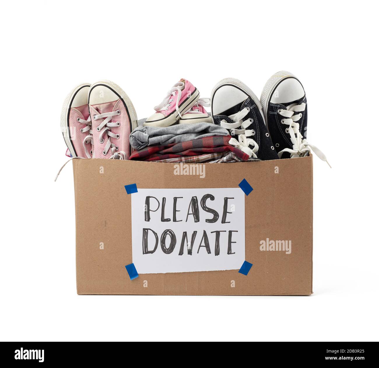 large brown cardboard box with the inscription please donate, box is ...