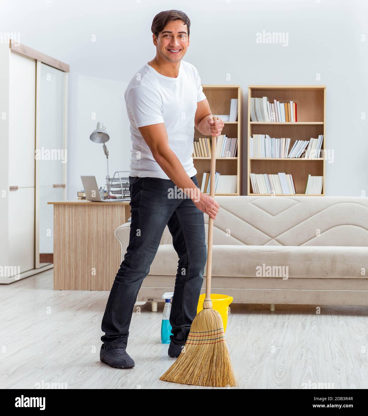 The man husband cleaning the house helping wife Stock Photo - Alamy