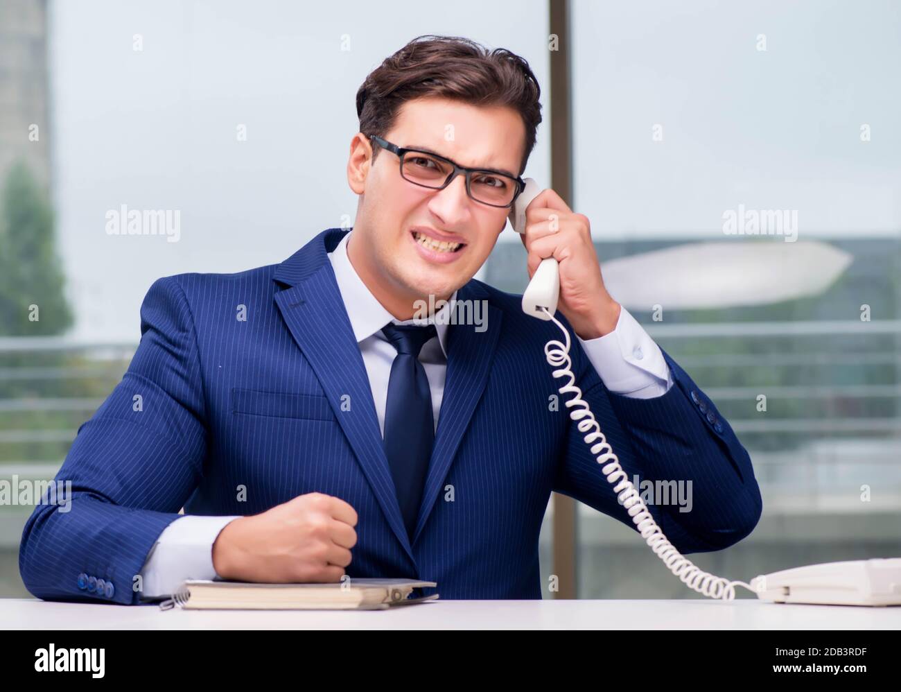 The angry call center employee yelling at customer Stock Photo - Alamy