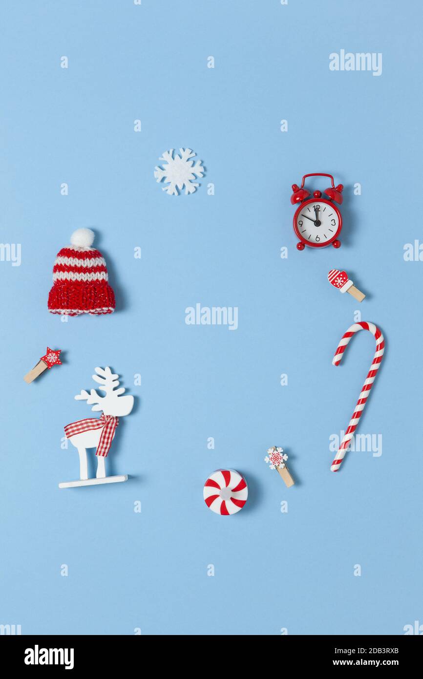 Simple creative Christmas composition. Candy cane, deer, hat, snowflake ...