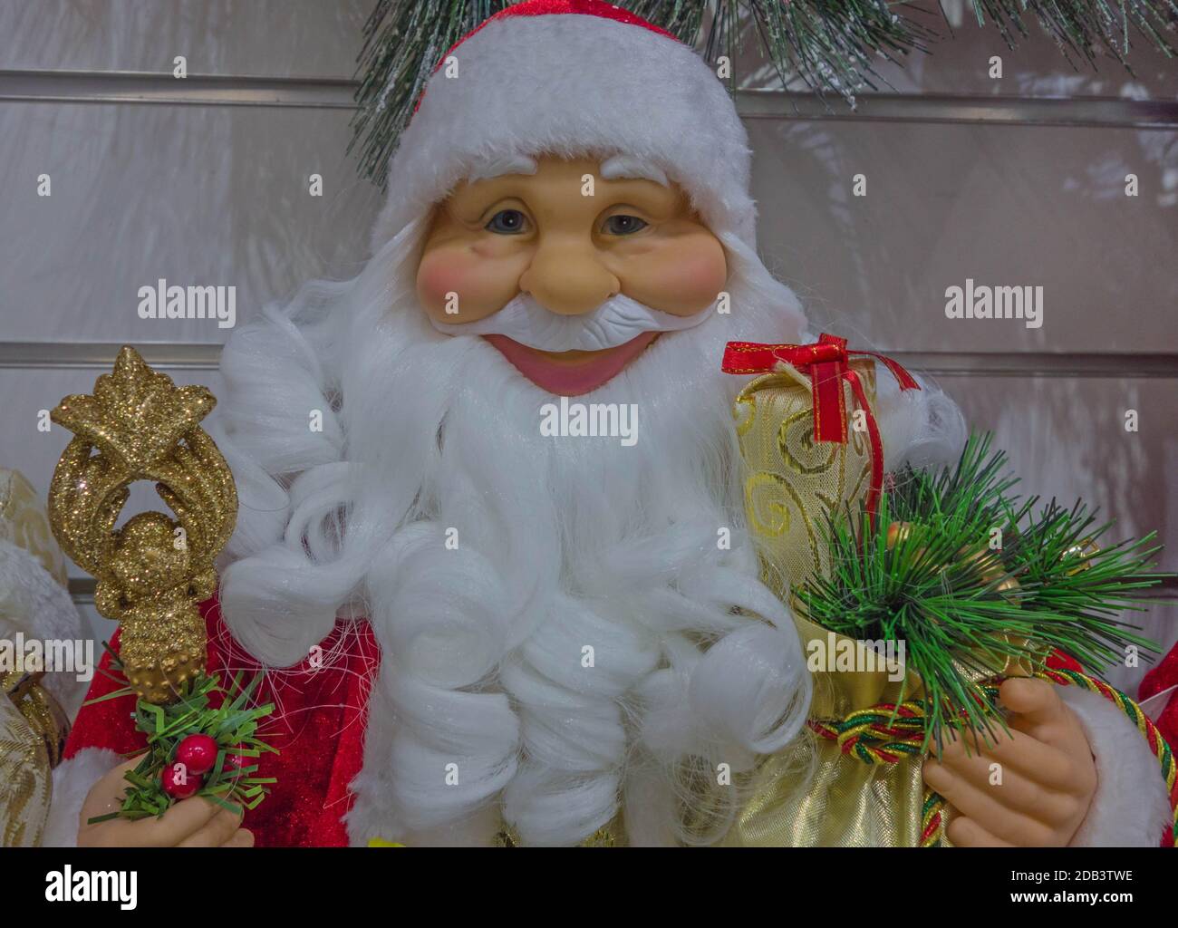 Traditional Father Christmas holding presents Stock Photo - Alamy