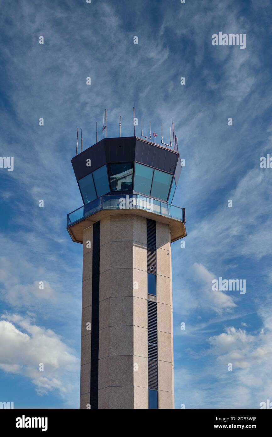 Control tower at a small regional airport against a clear blue sky ...
