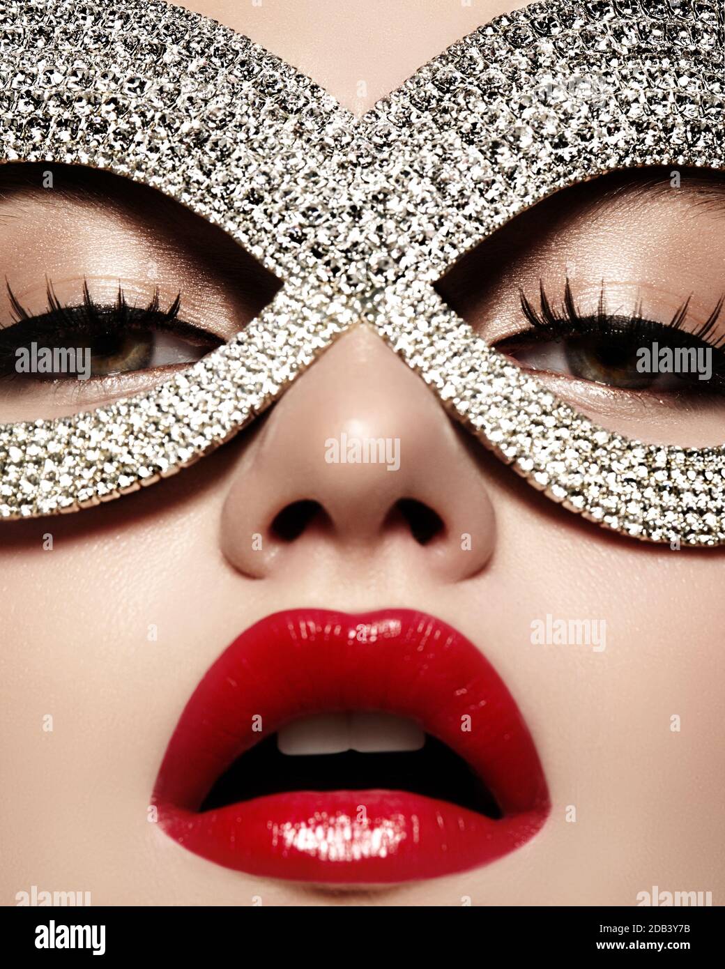 Beautiful Model with Fashion luxe Lips Make-up wearing bright brilliant ...