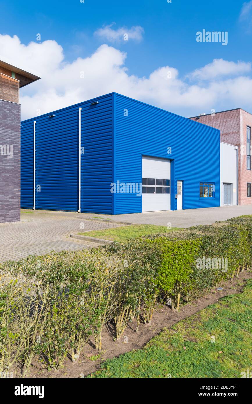 exterior of a modern warehouse with a small office unit Stock Photo - Alamy