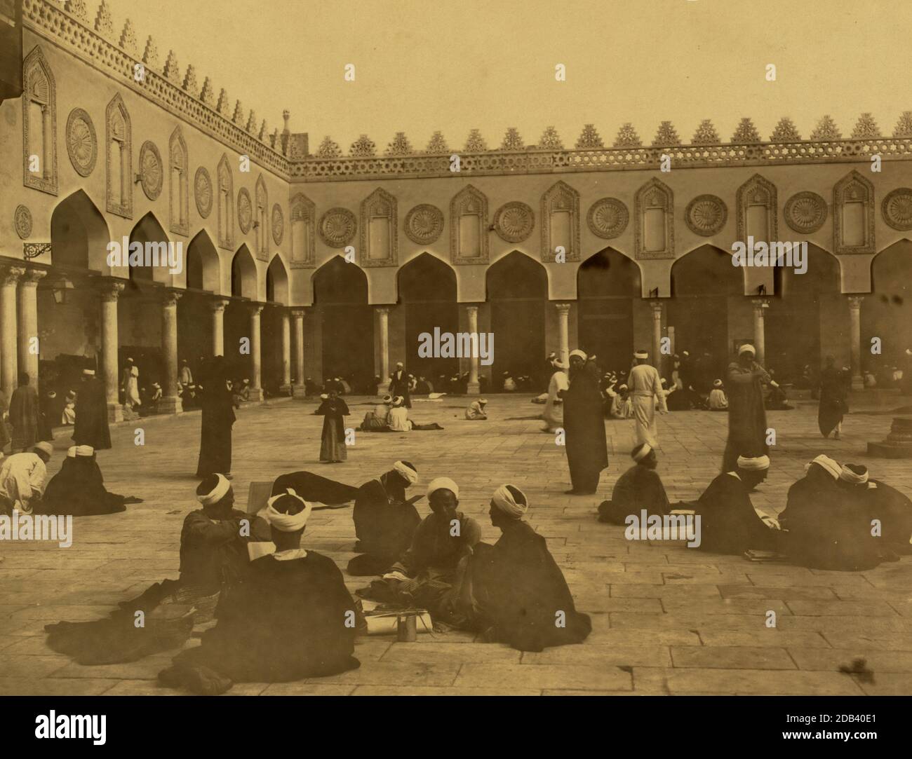 Several groups of theologians, many seated, some writing, in the ...