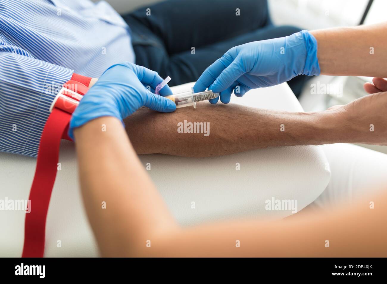 Senior man having a blood test done by a nurse Stock Photo - Alamy