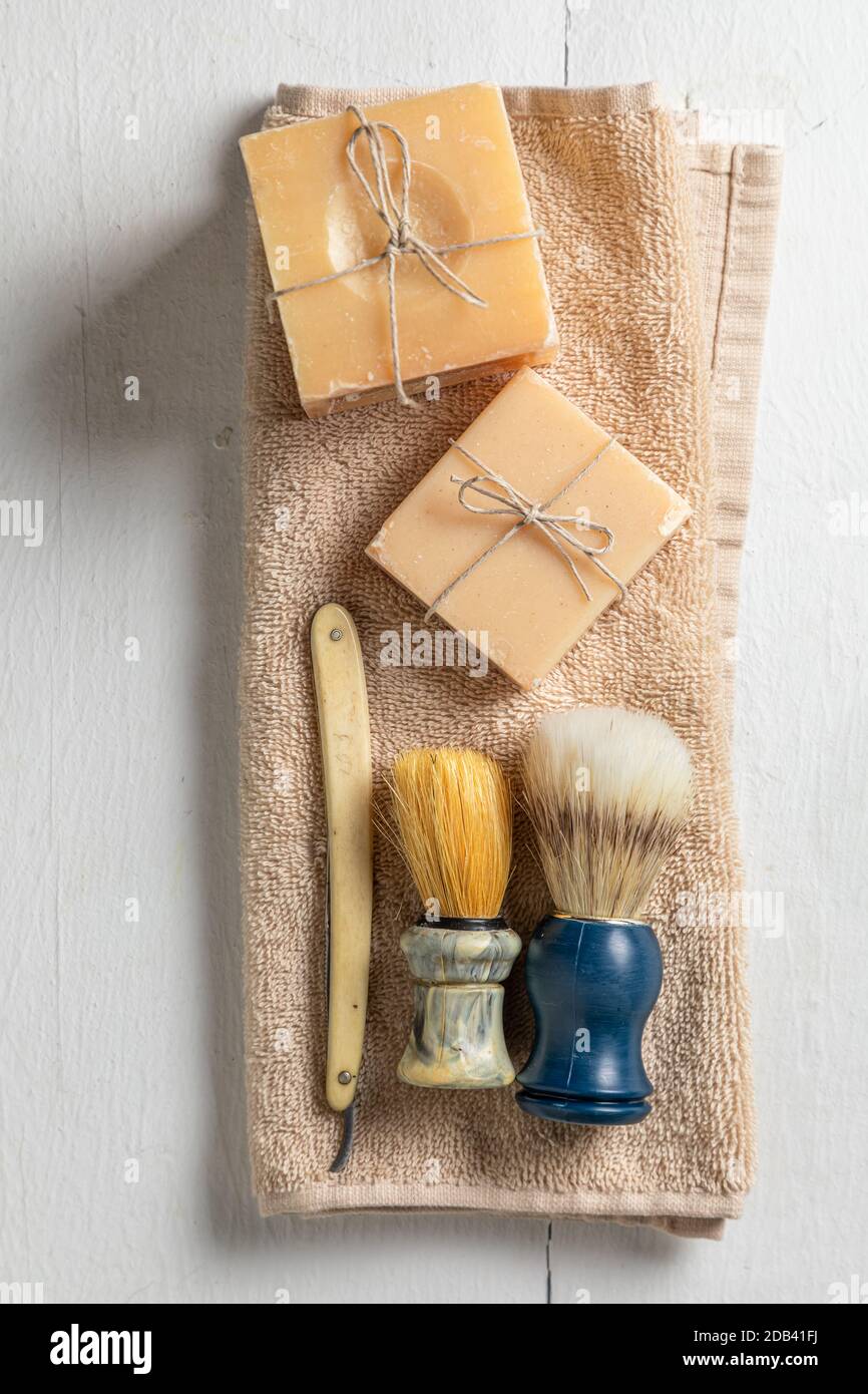 Vintage shaving set with razor, brush and soap on white table Stock ...