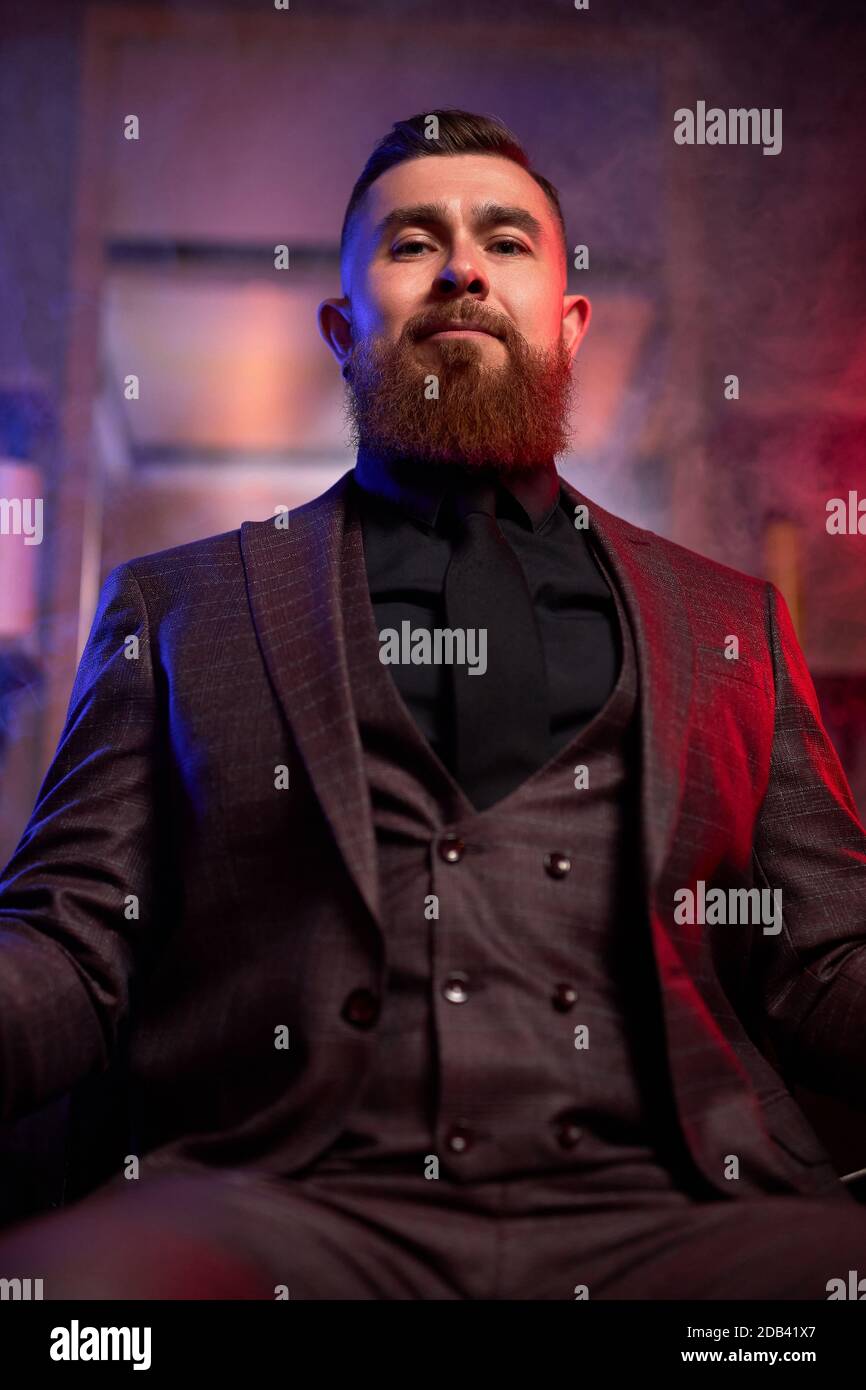 successful male barber shop owner sits feel himself superior, indoors ...