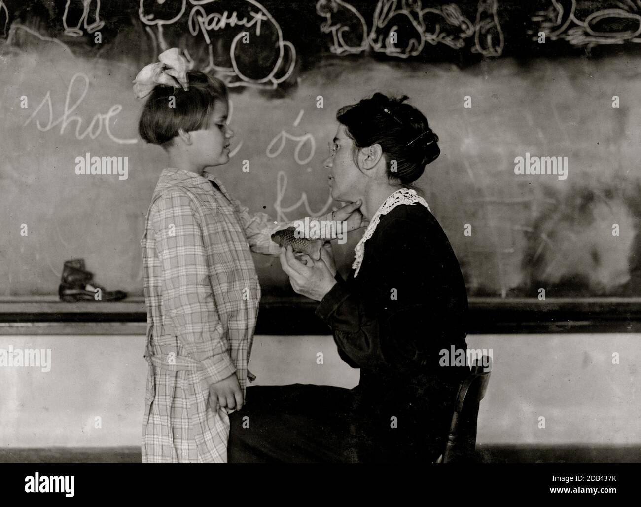 Teaching a deaf-mute to talk. Training School for Deaf Mutes Stock ...