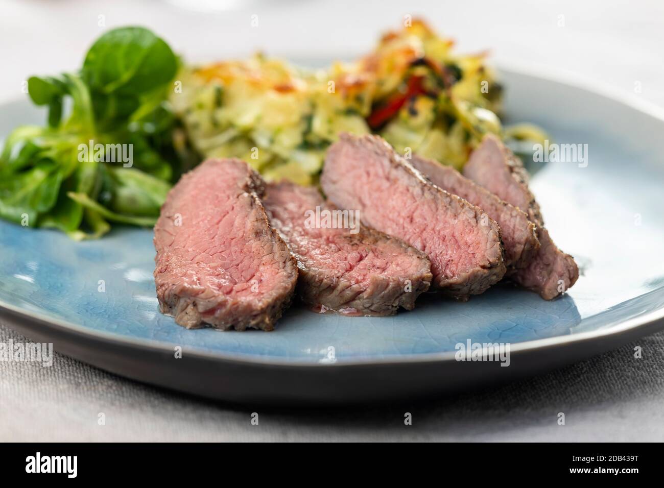 slices of pork fillet on a plate Stock Photo - Alamy