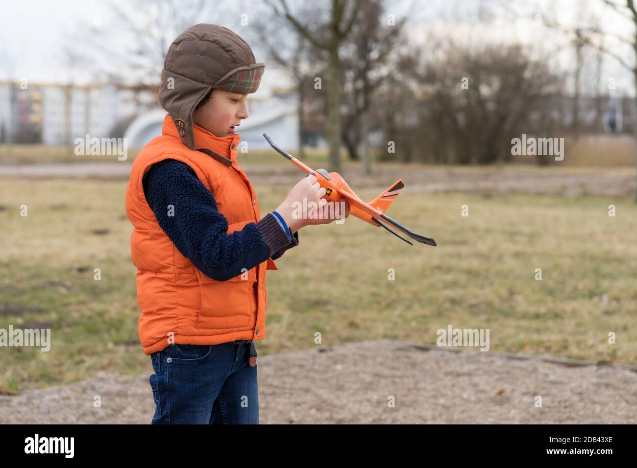 Boy playing in nature with a model of a glider (airplane Stock Photo ...