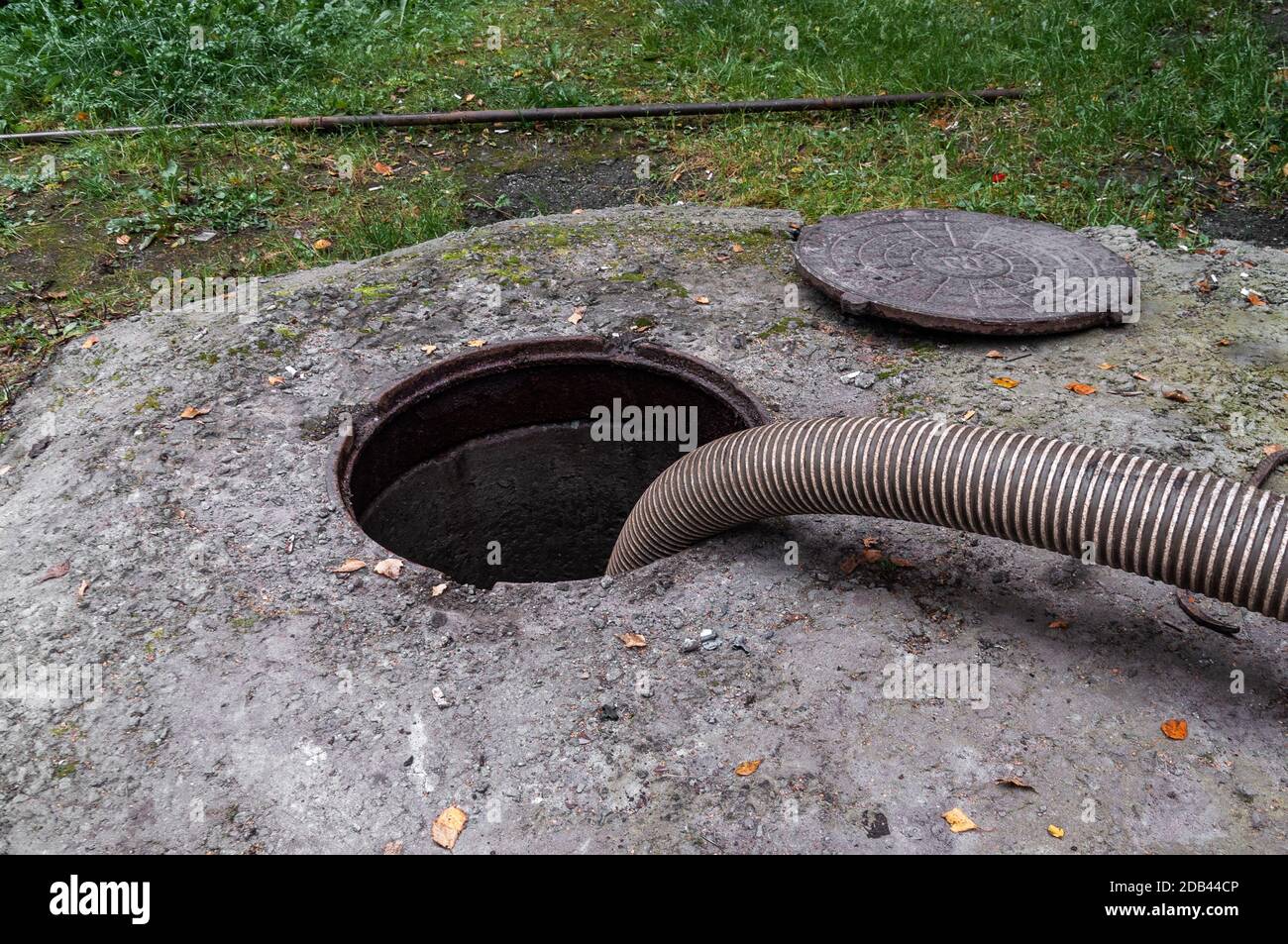 pipe placed in a manhole. repair of the city heating system Stock Photo ...