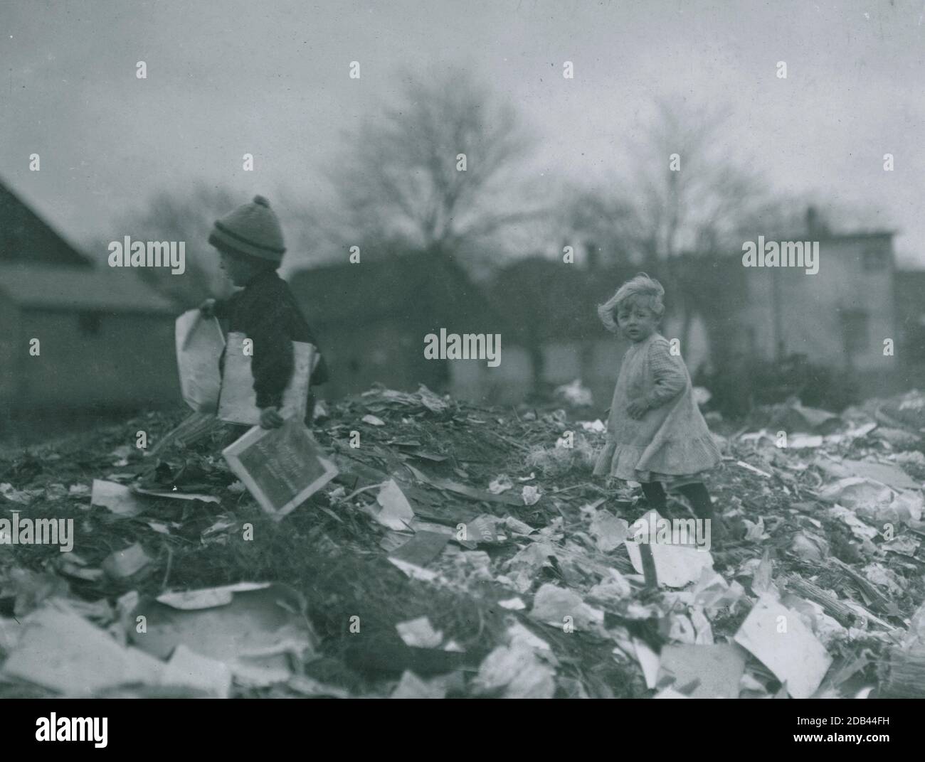 Two children going through the "Dumps." Location Stock Photo - Alamy
