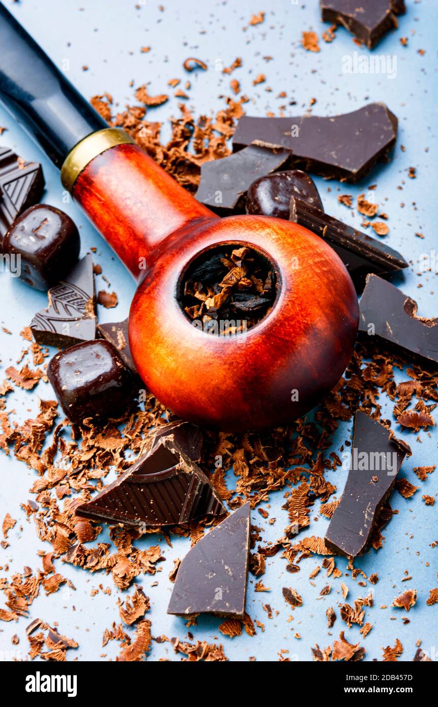 Chocolate flavored tobacco for smoking pipes.Tobacco pipe filled with ...