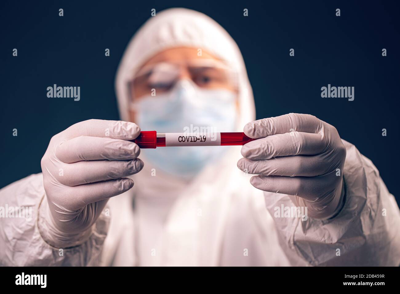 Coronavirus covid-19 infected blood sample in sample tube in hand of ...