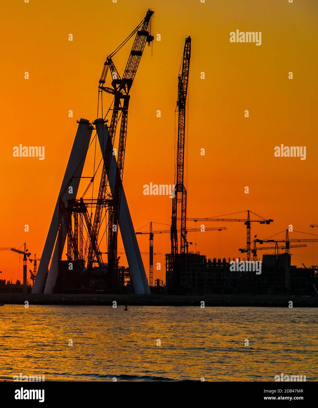Dubai at the sea sunset, Construction site in bay Stock Photo - Alamy