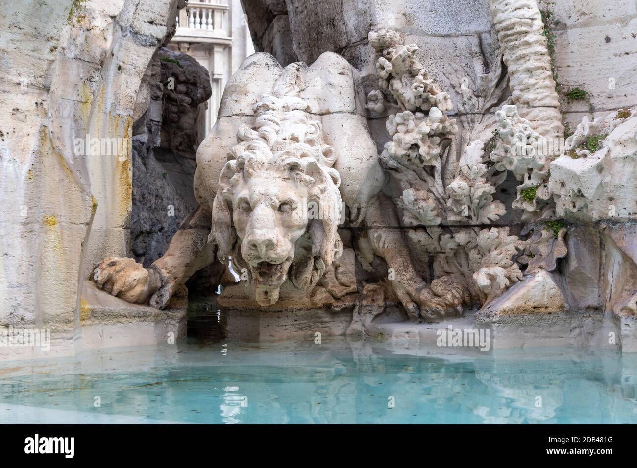 Detail of lion statue at famous Fountain of the Four Rivers. Navona ...