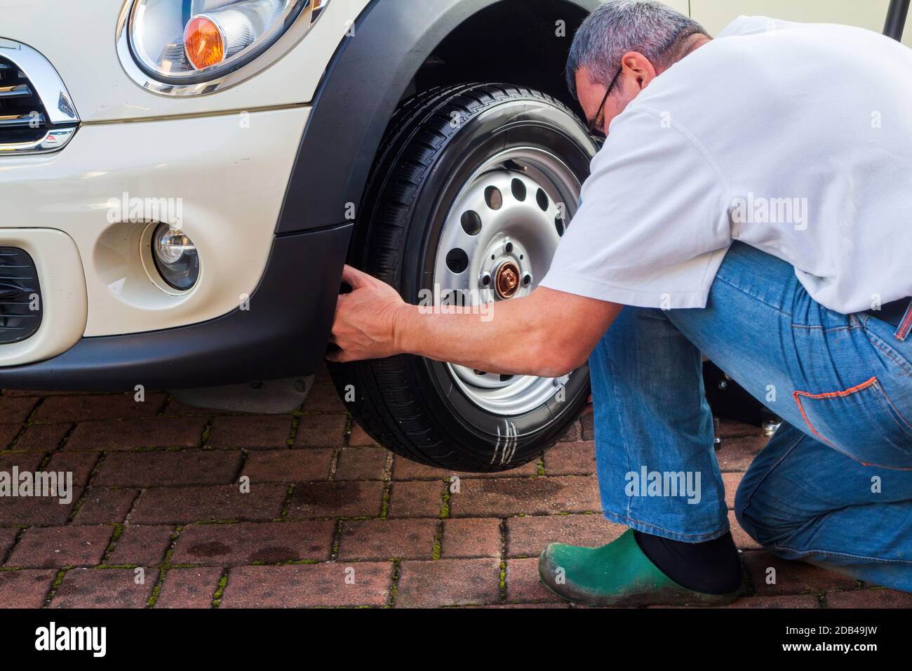 Man fixing car home hi-res stock photography and images - Alamy