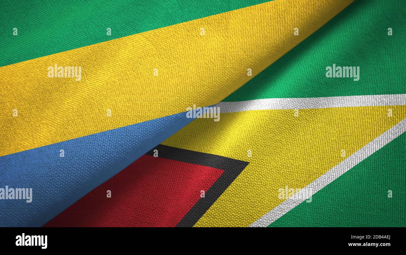 Gabon and Guyana two flags textile cloth, fabric texture Stock Photo ...
