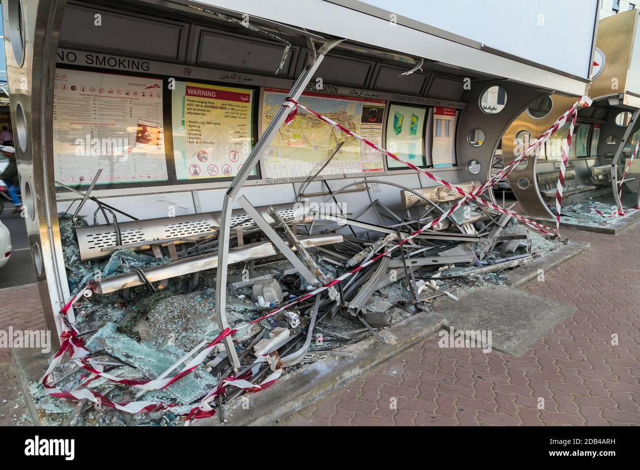 DUBAI, UAE - JANUARY 26: Broken glass window bus stop in Dubai. Roads ...