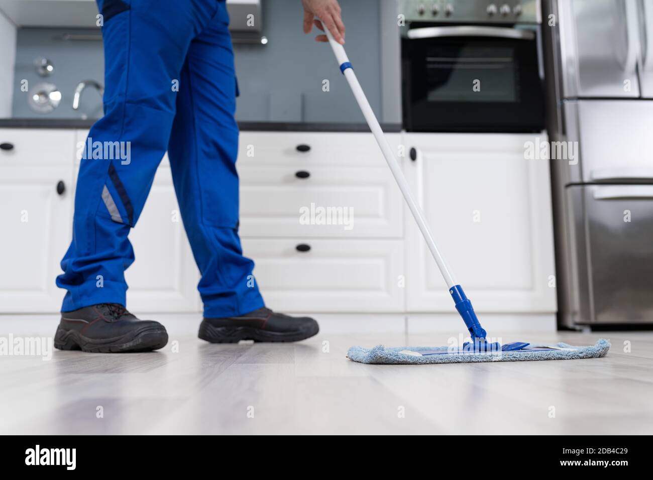 Sweeping mopping floor kitchen hi-res stock photography and images - Alamy