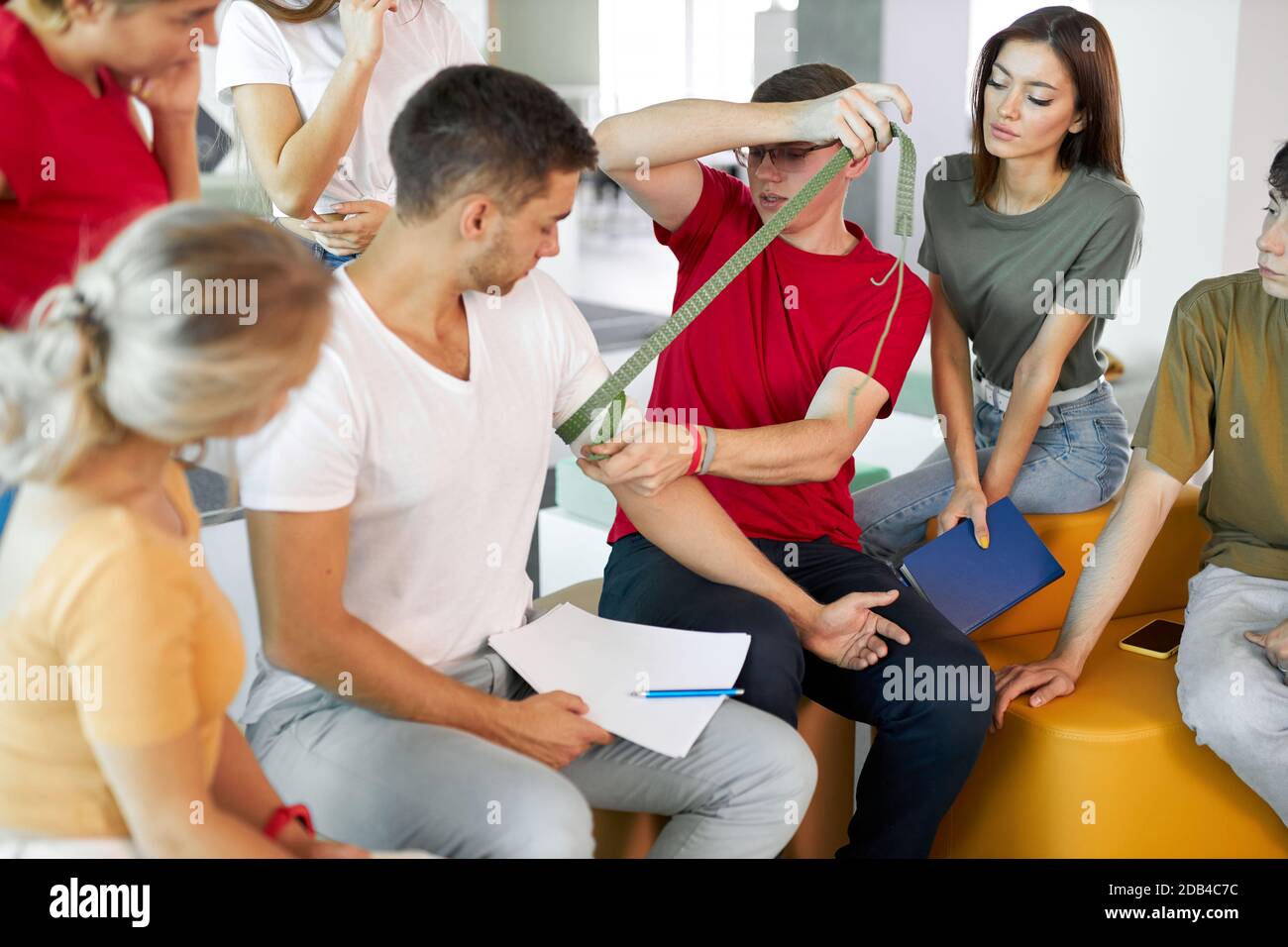 at first aid training classroom, group of students are learning to ...