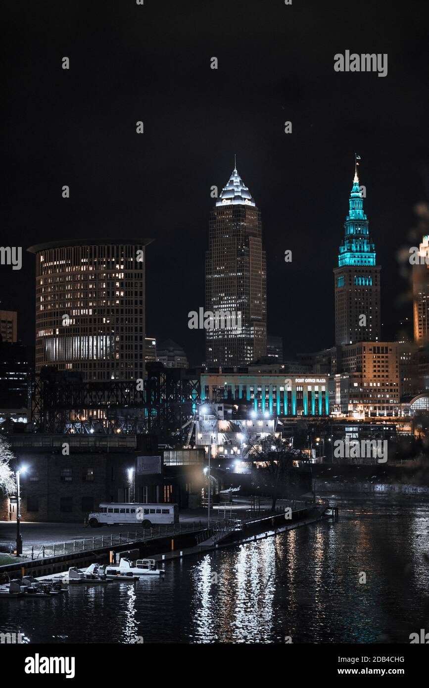 Cleveland ohio skyline at night with a ship on the cuyahoga river Stock ...