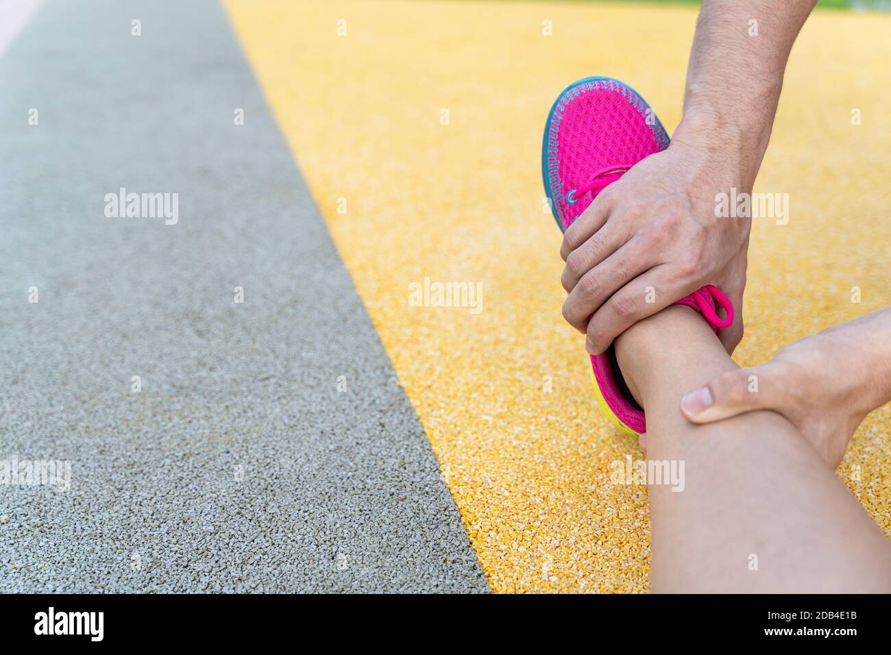Male hand grab female leg to stretch after exercise injury Stock Photo ...