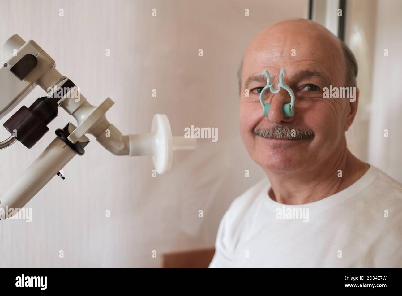 Senior man testing breathing function by spirometry Stock Photo - Alamy