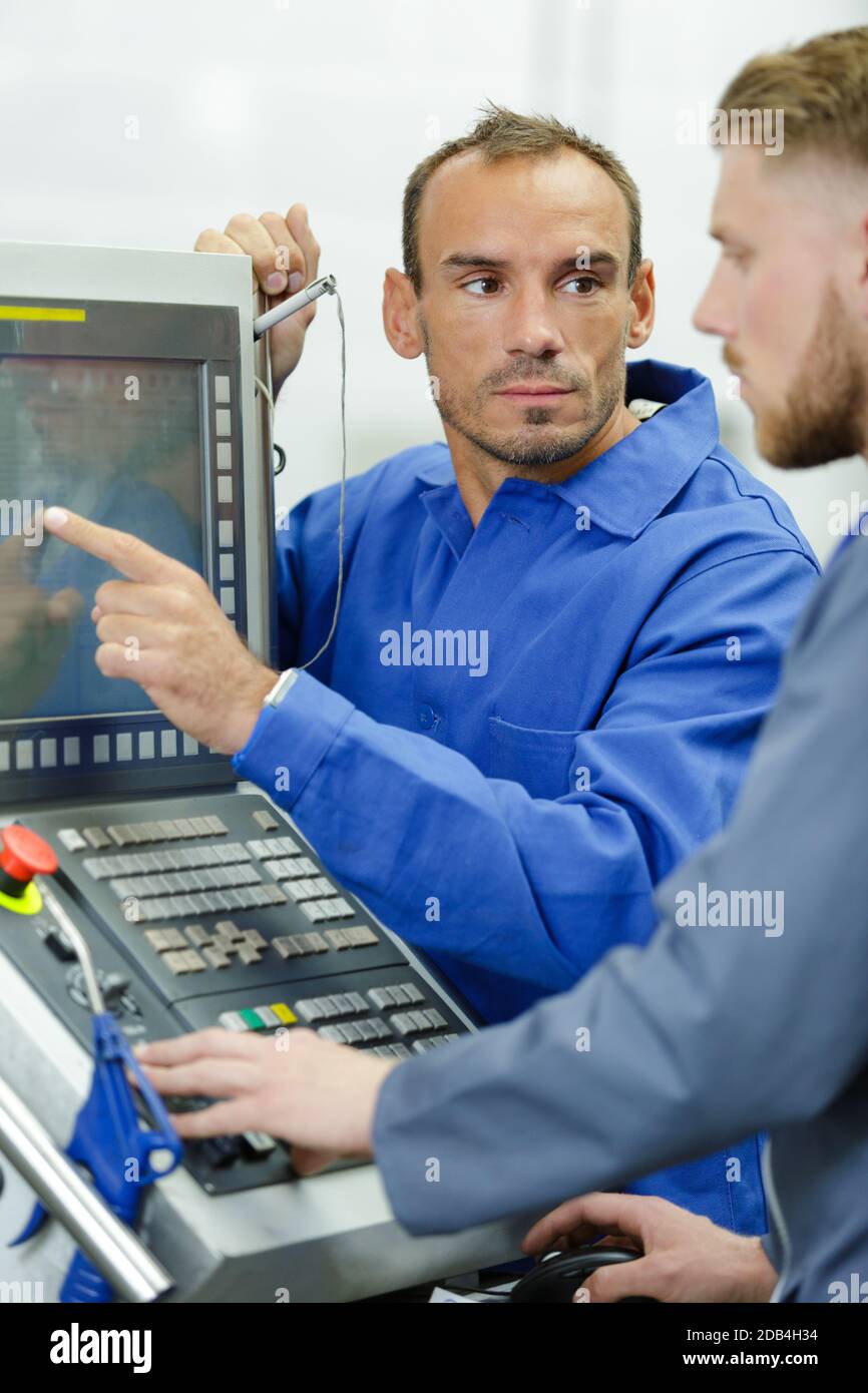 workers on control the production process Stock Photo - Alamy
