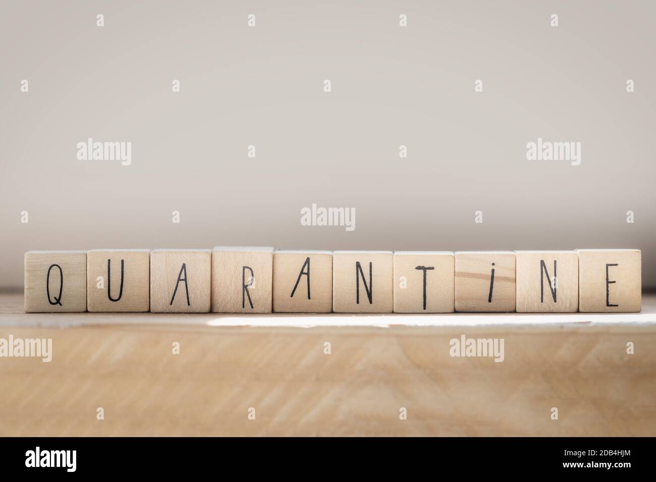 Wooden cubes with the word quarantine concept represented by wooden ...