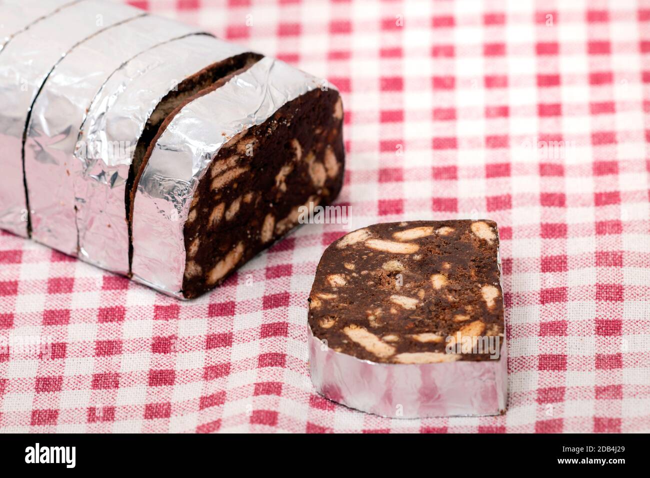Traditional portuguese sweet chocolate salame over a table cloth Stock ...