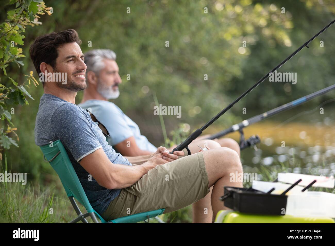 two contented and relaxed men fishing Stock Photo - Alamy