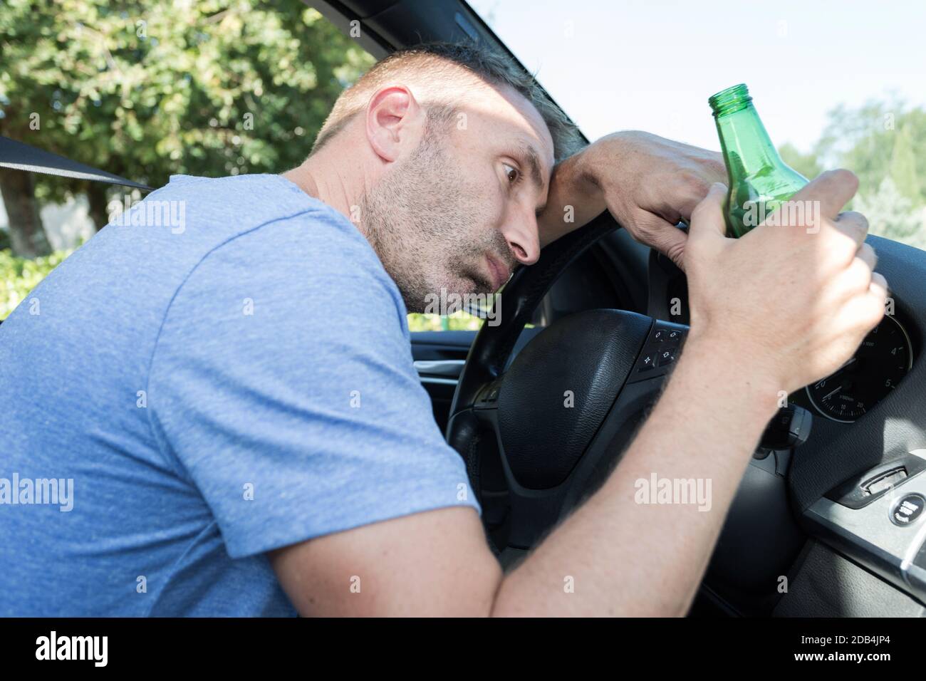 man drinking alcohol while driving the car Stock Photo - Alamy