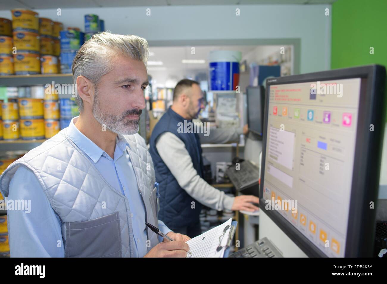 Man cashier standing pay hi-res stock photography and images - Alamy