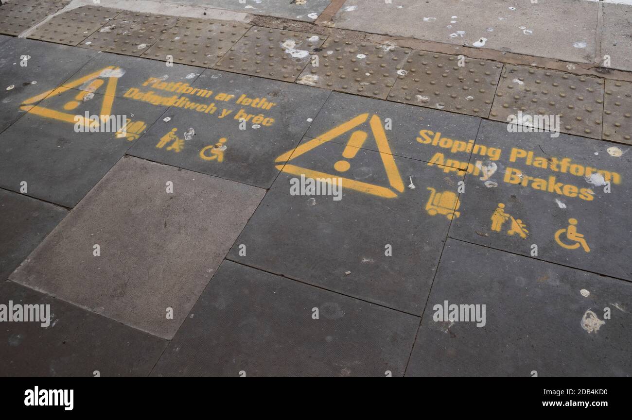Train station with bilingual safety signs in Welsh and English in ...