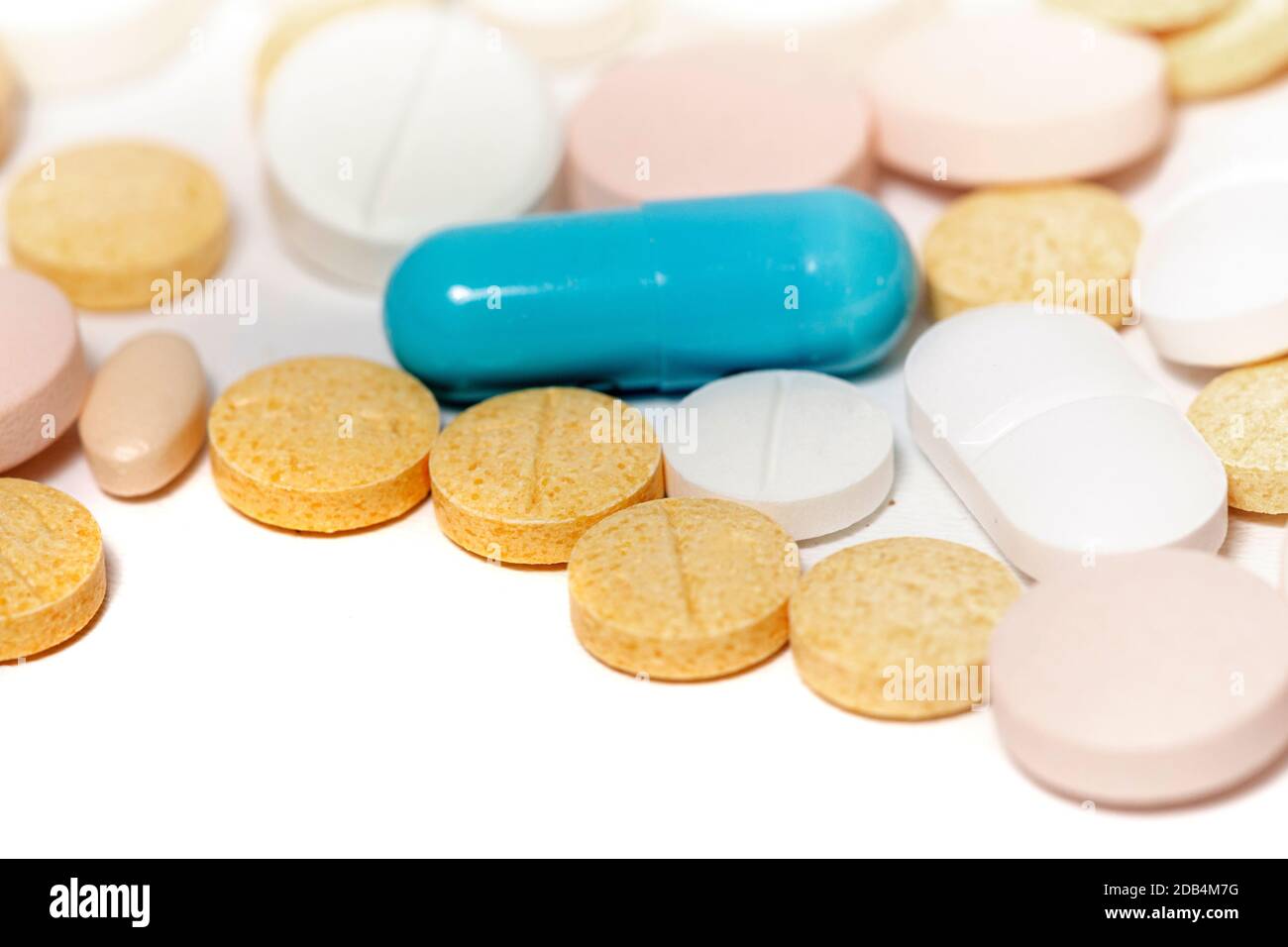 Assorted mix of pills over a white background Stock Photo - Alamy