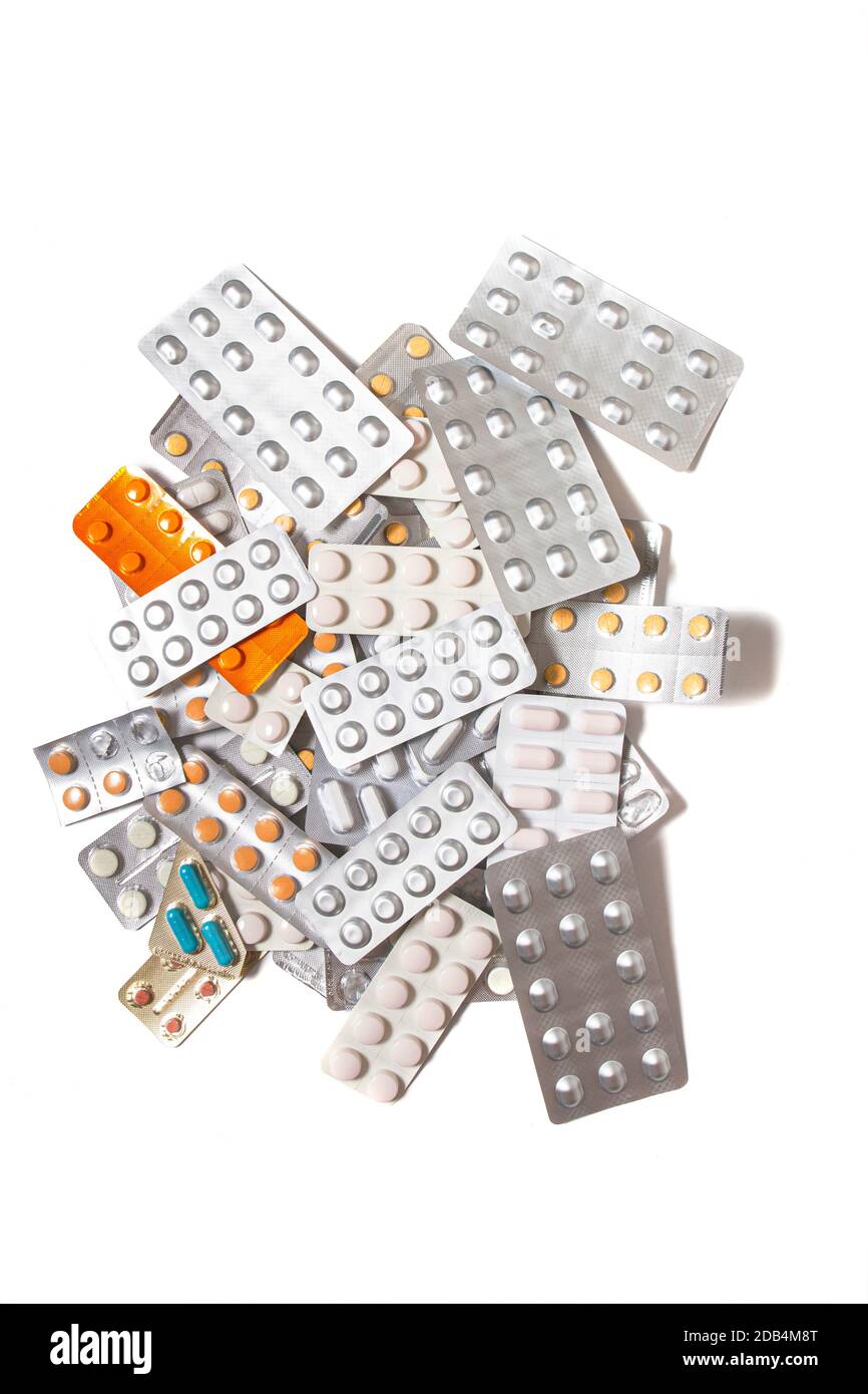 Assorted mix of pills over a white background Stock Photo - Alamy