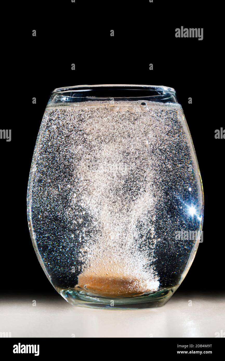 View of a effervescent Tablet dissolving in water Stock Photo - Alamy