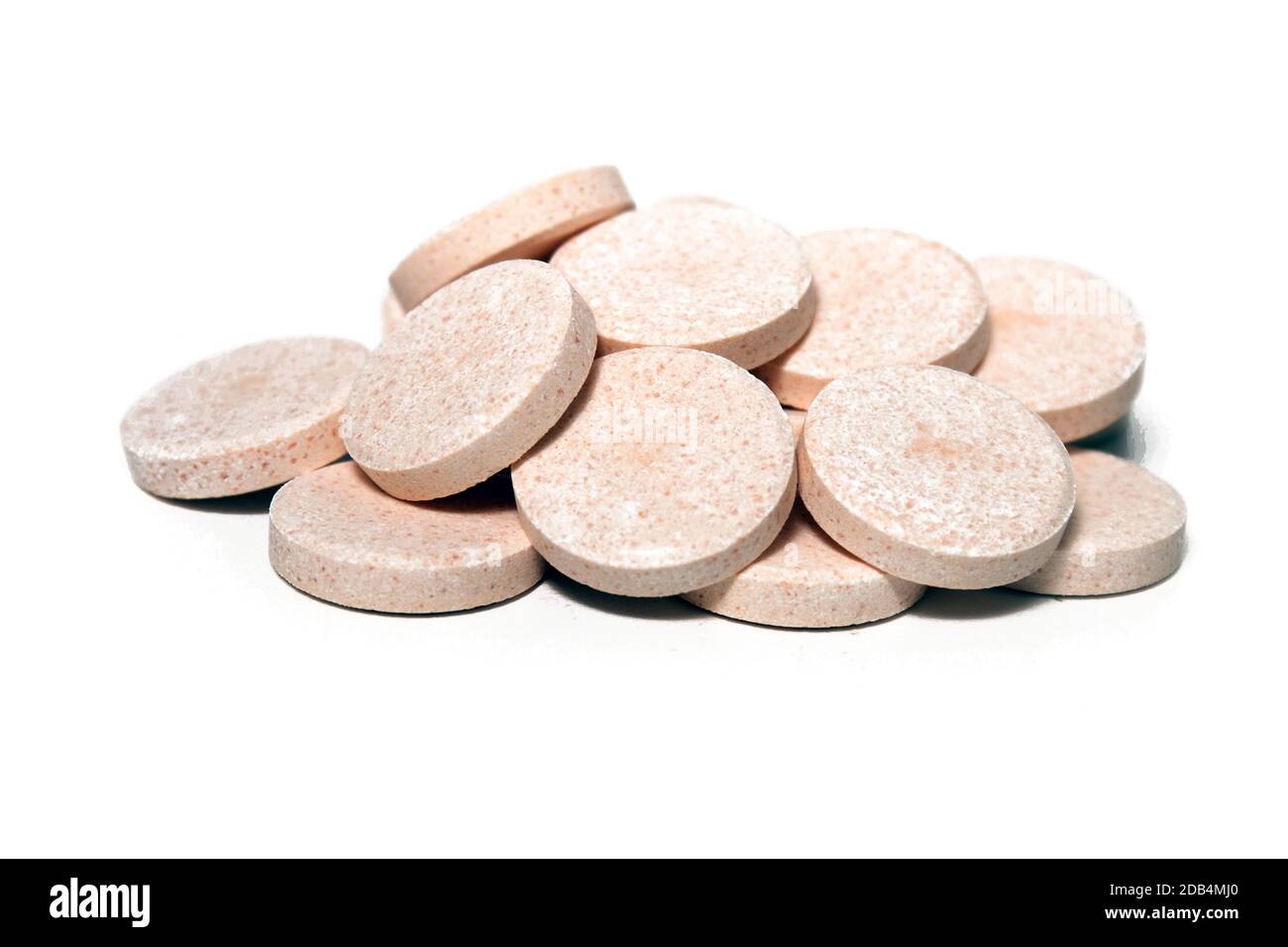 View of a pile of effervescent Tablets isolated on a white background ...
