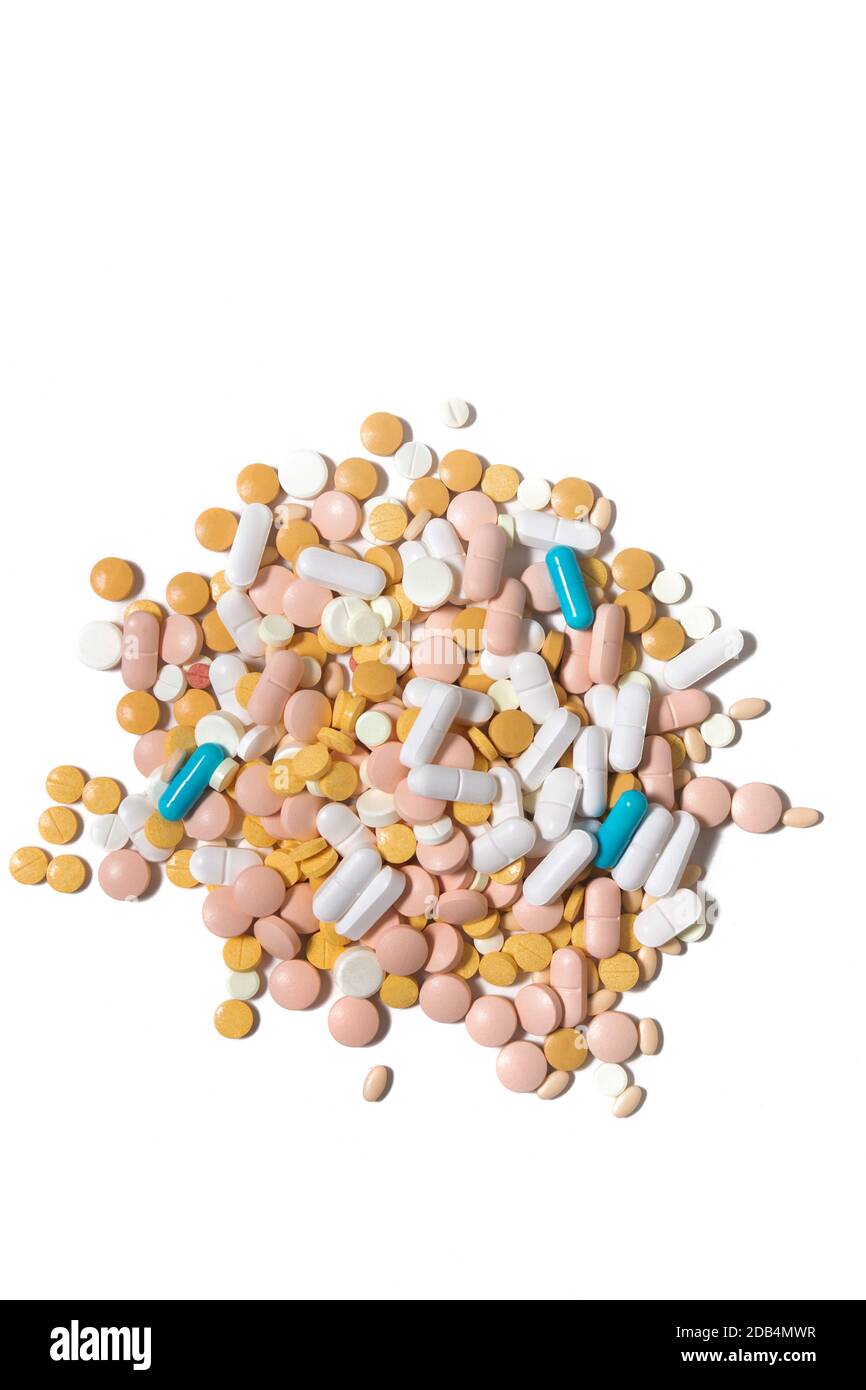 Assorted mix of pills over a white background Stock Photo - Alamy
