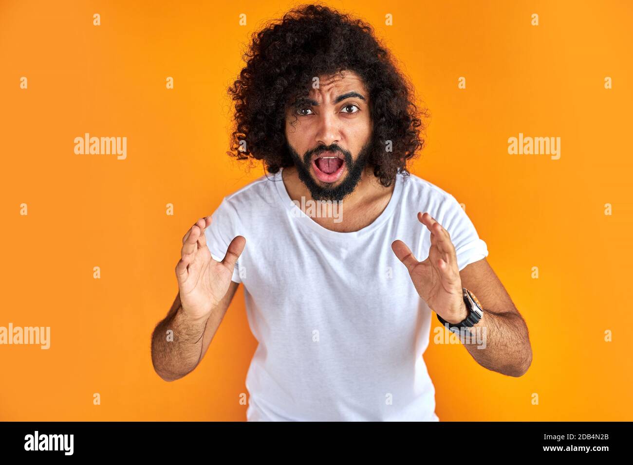 angry arabic man scream at camera isolated on orange background ...