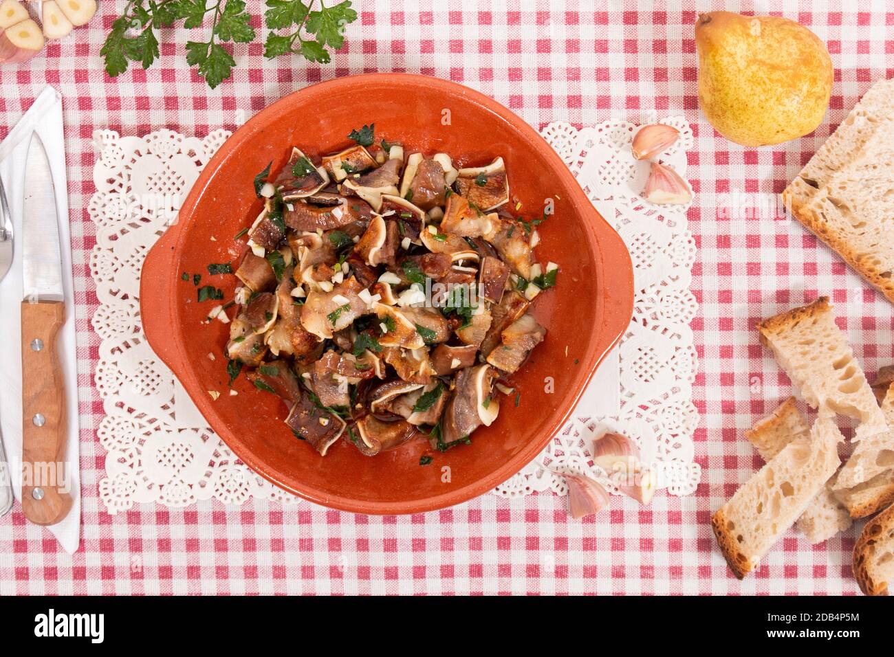 roasted pig ear with garlic and olive oil Stock Photo - Alamy