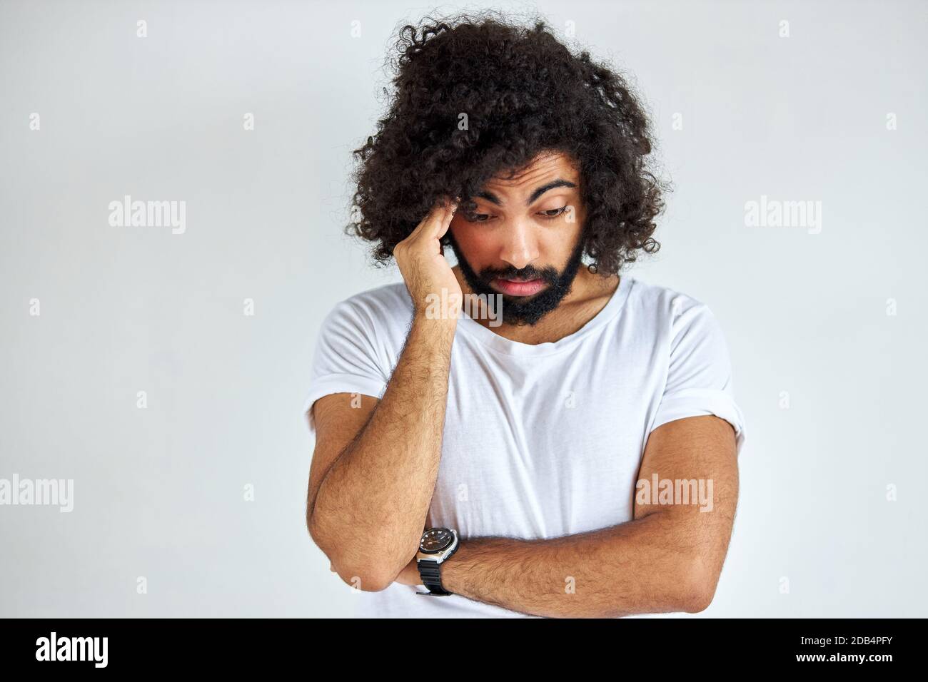 sad arabic man has problems, he is depressed, hold hand on head, stand ...