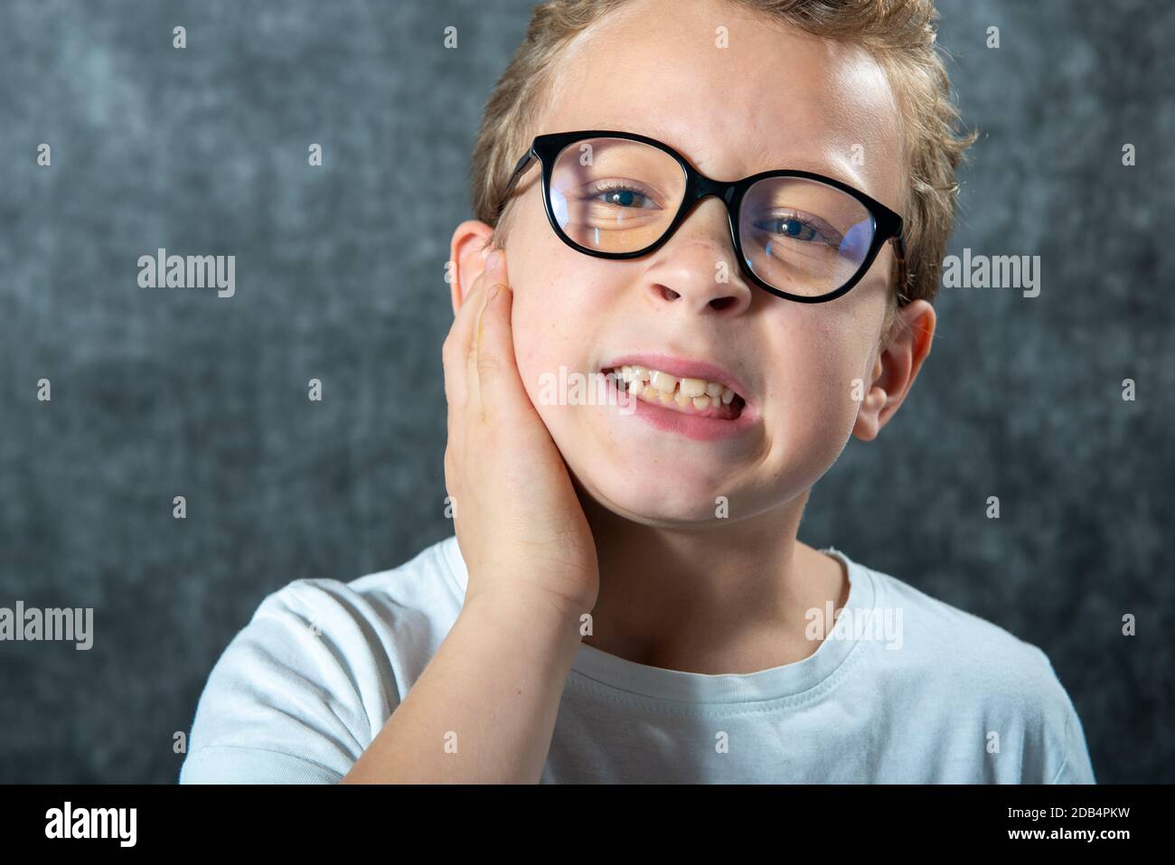 a boy suffering from ear pain Stock Photo - Alamy